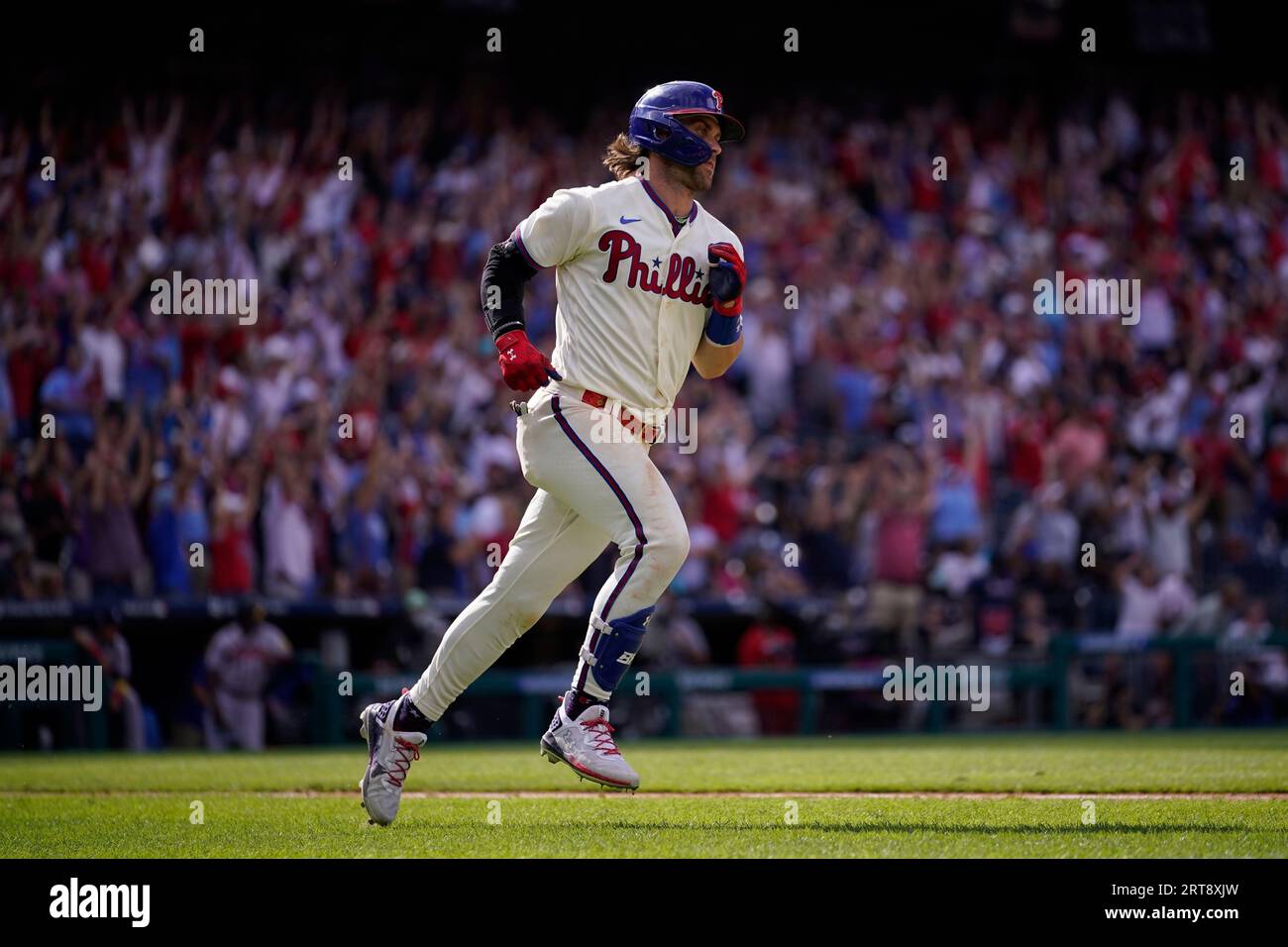 Philadelphia Phillies' Bryce Harper runs after a home run during the first baseball game in a ...