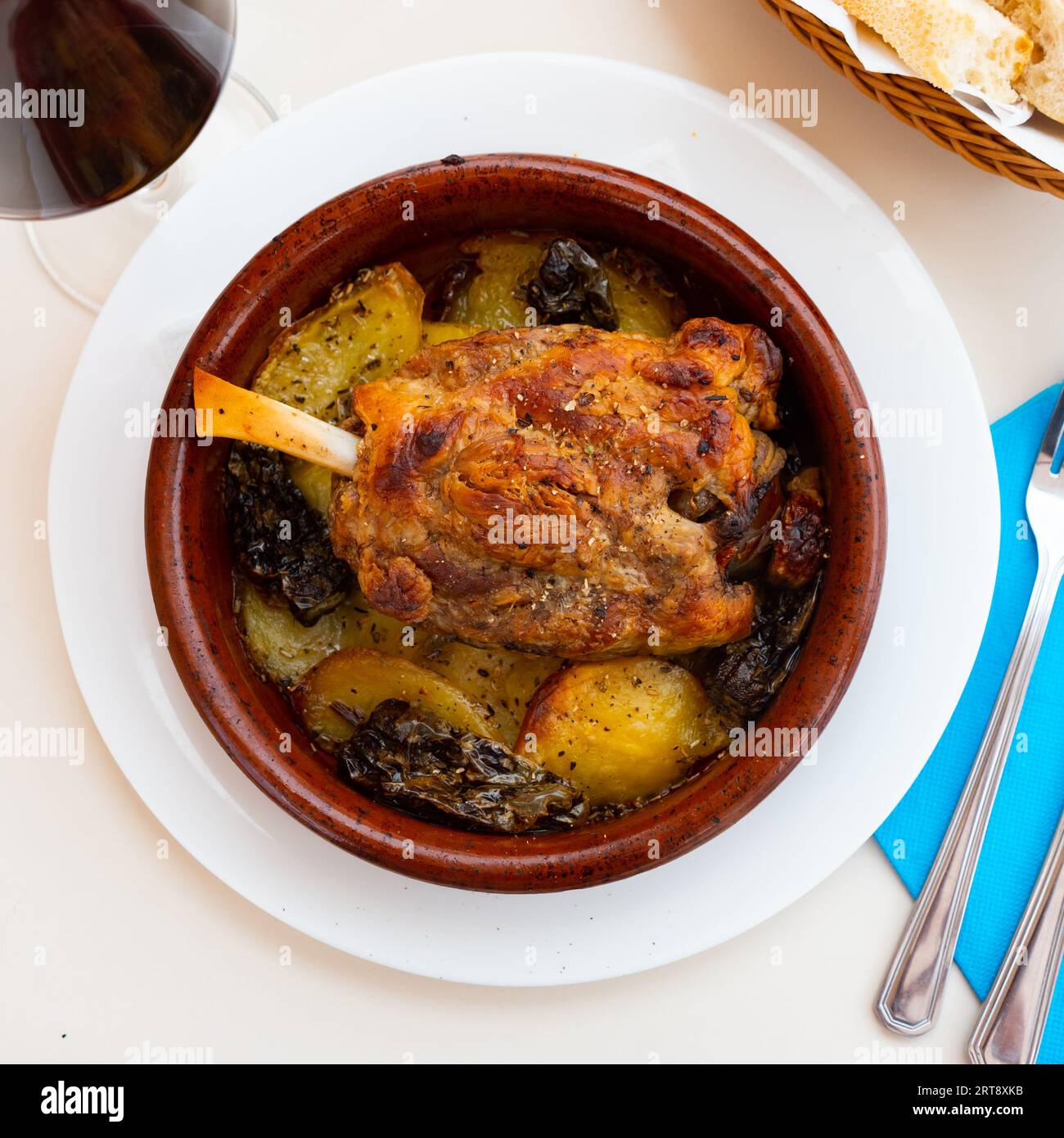 Roasted pork knuckle served with vegetable side dish of potatoes Stock ...