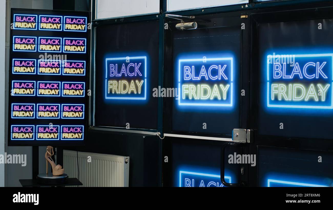 Entrance of clothing store with black friday signs, retail shop front ...