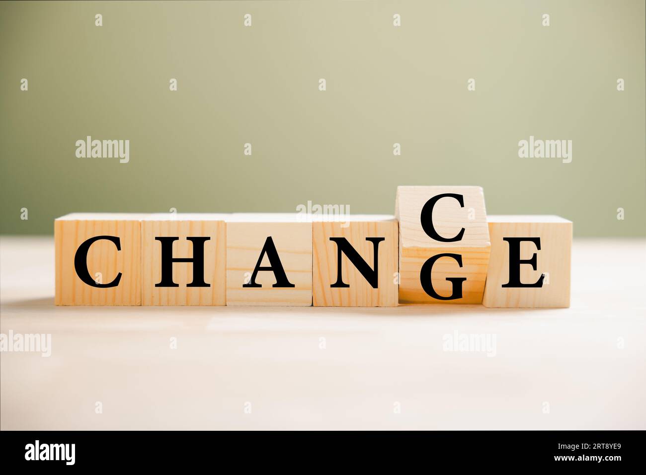 Flipping wooden cube block for Change to Chance Stock Photo - Alamy