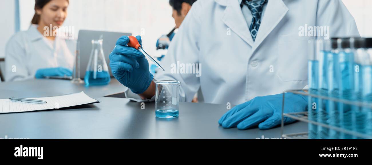 Group of dedicated scientist conduct chemical experiments and research ...