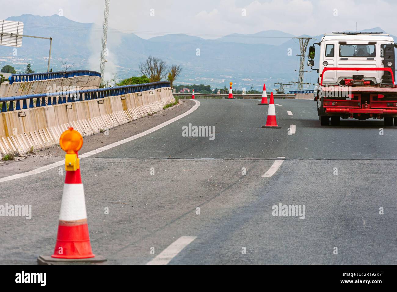 passing road under repair with special special equipment on the track Stock Photo - Alamy