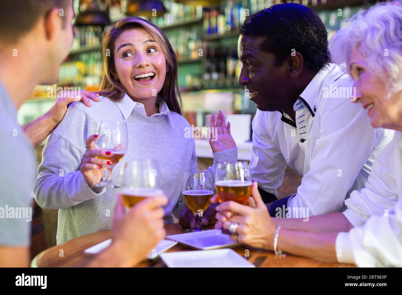Diverse group having an awkward conversation Stock Photo - Alamy
