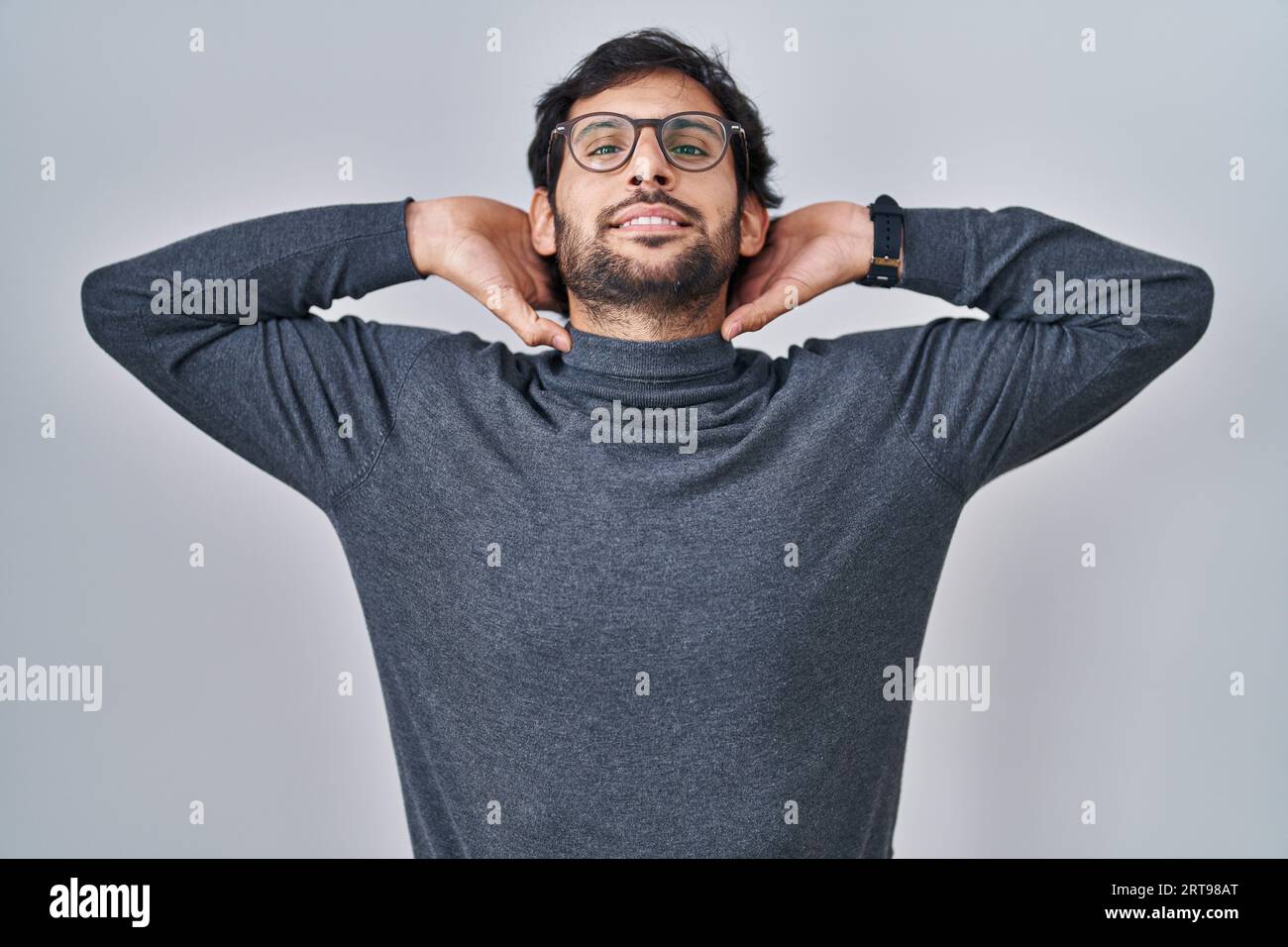 Handsome latin man standing over isolated background relaxing and ...