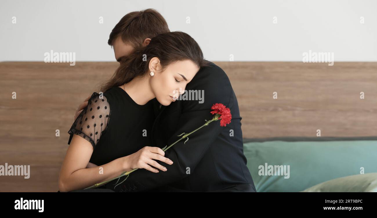 Couple pining after their relative after funeral Stock Photo - Alamy