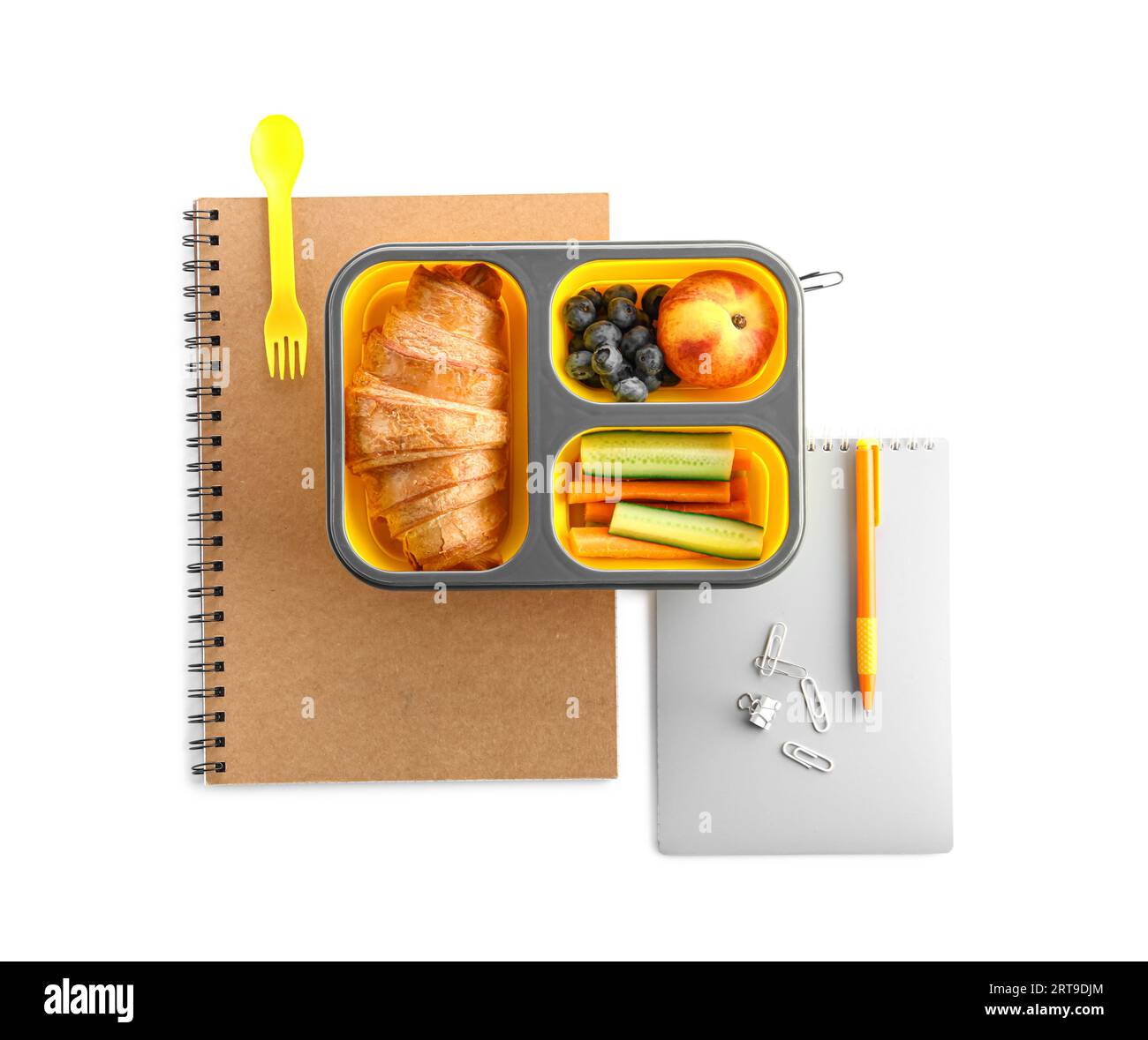 Stationery and lunchbox with yummy food isolated on white background ...