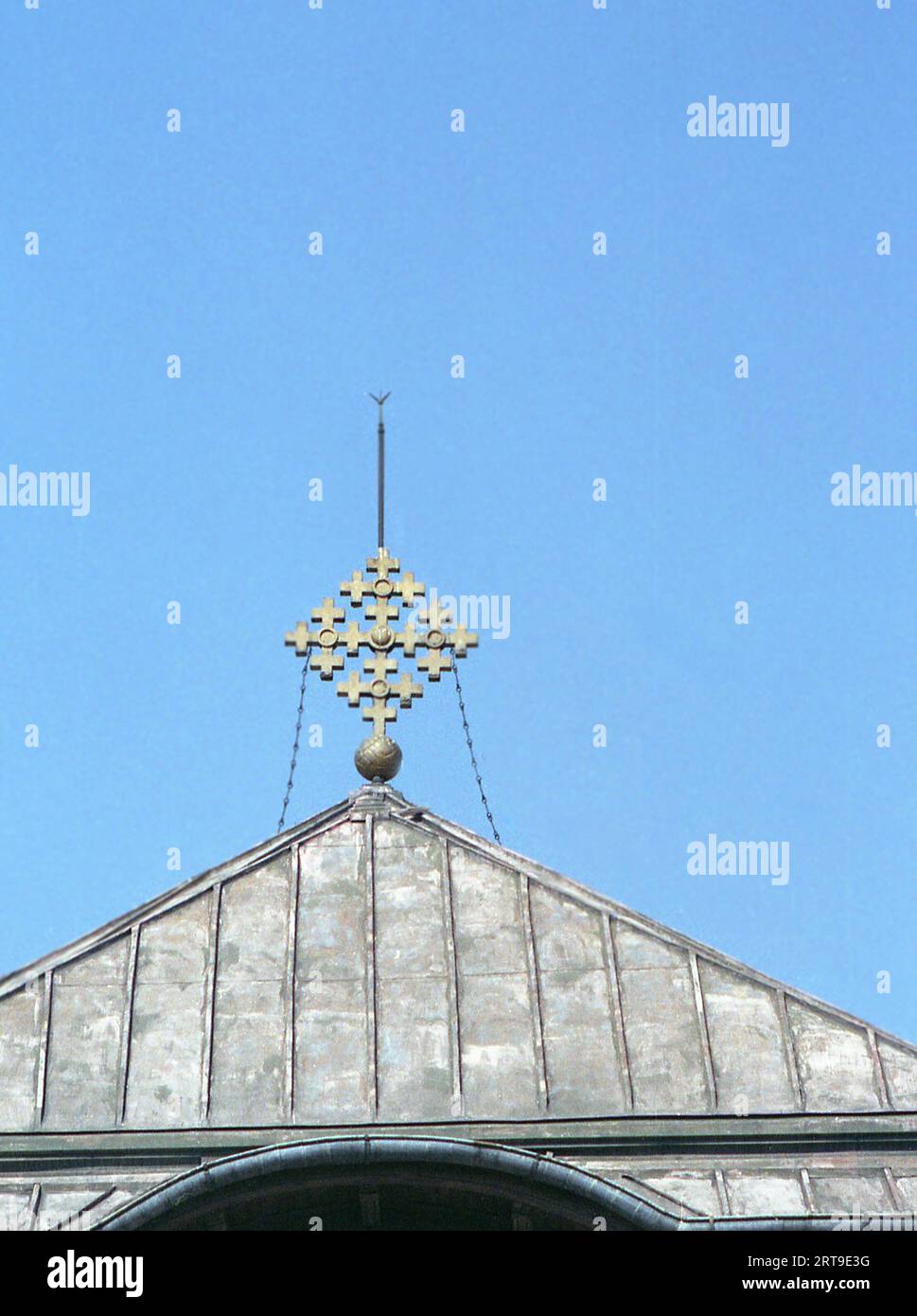 Bucharest, Romania, approx. 2000. Cross on top of one building of the ...