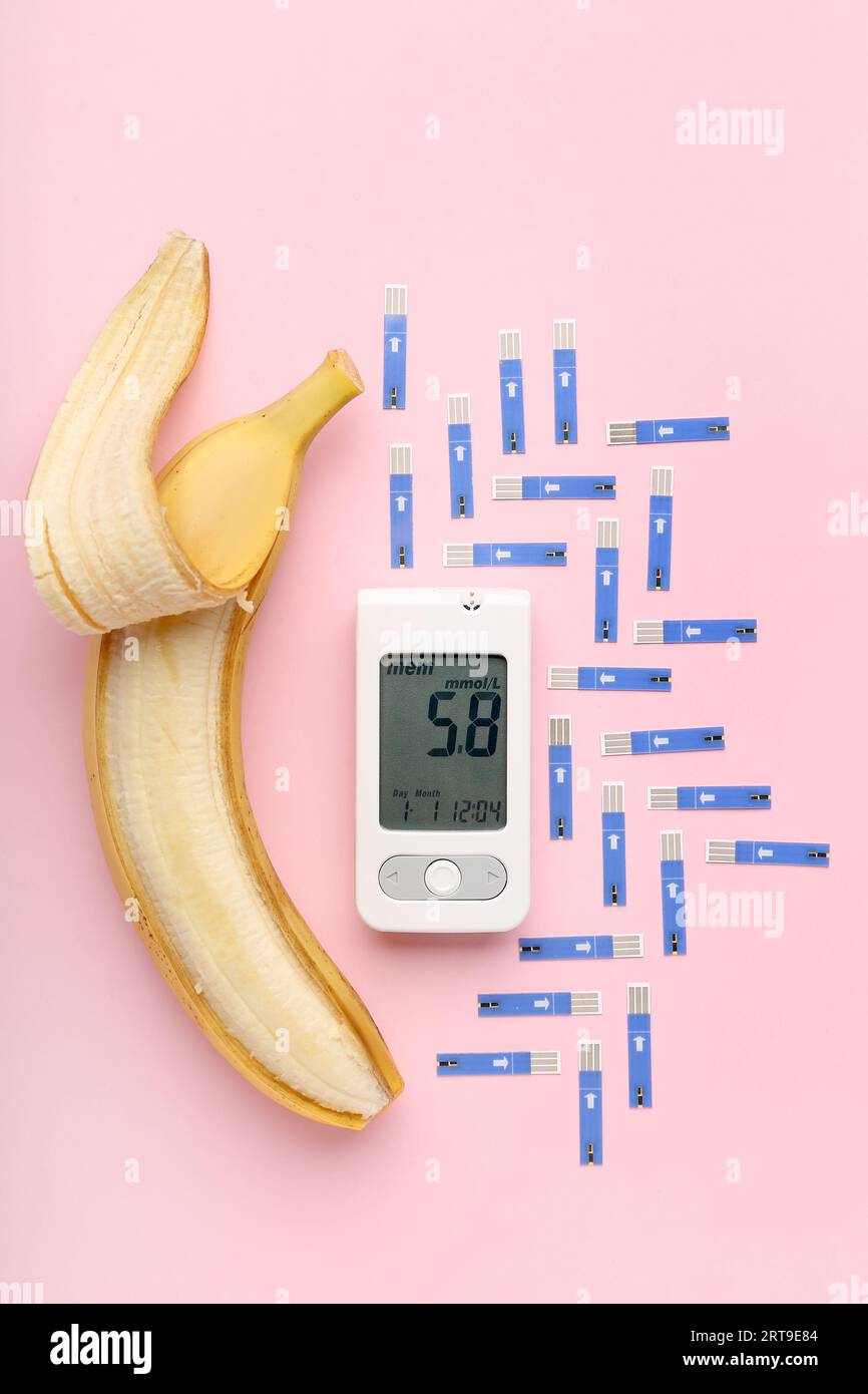 Composition with digital glucometer, ripe banana and scarificators on ...