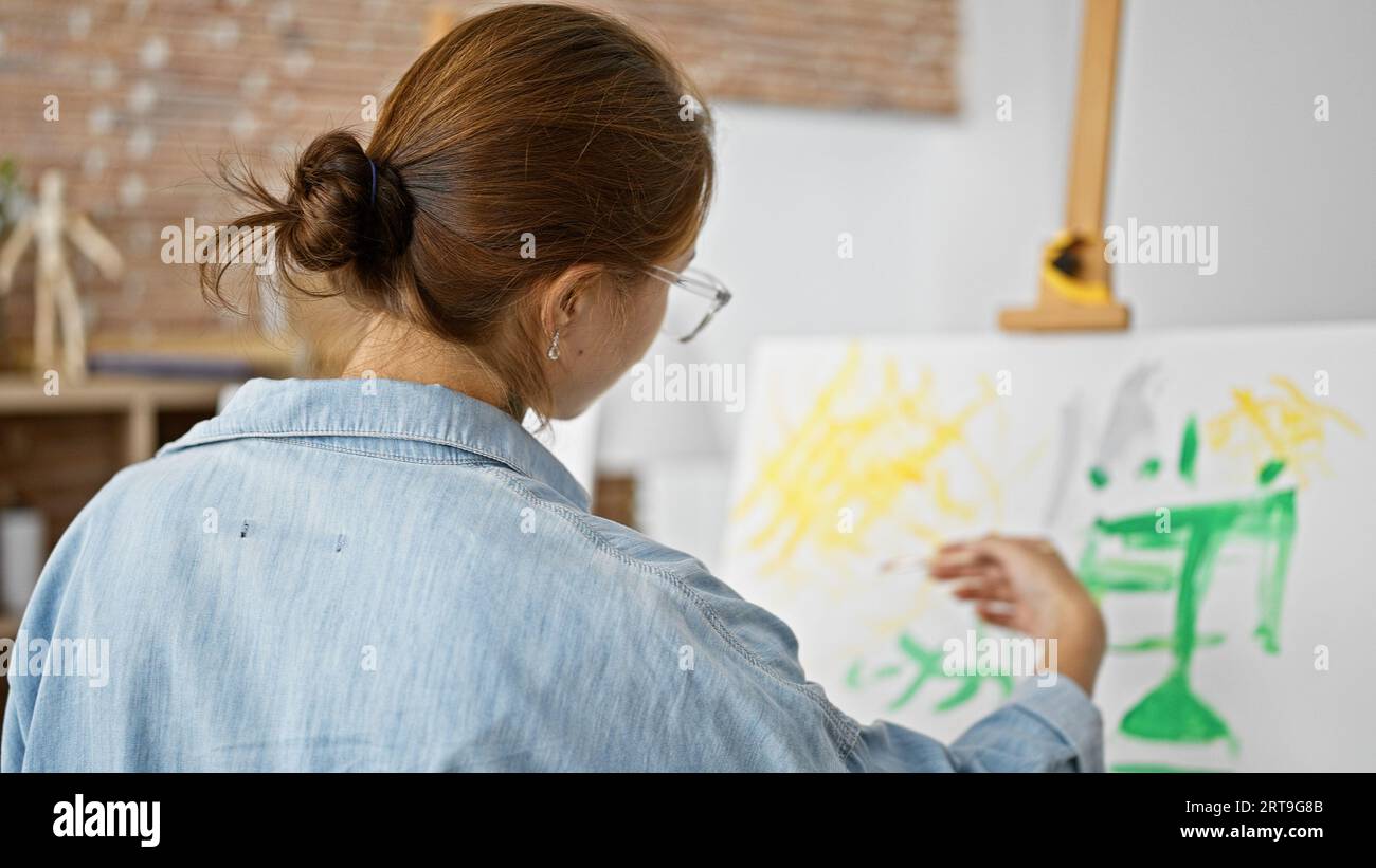 Young woman artist drawing at art studio Stock Photo - Alamy
