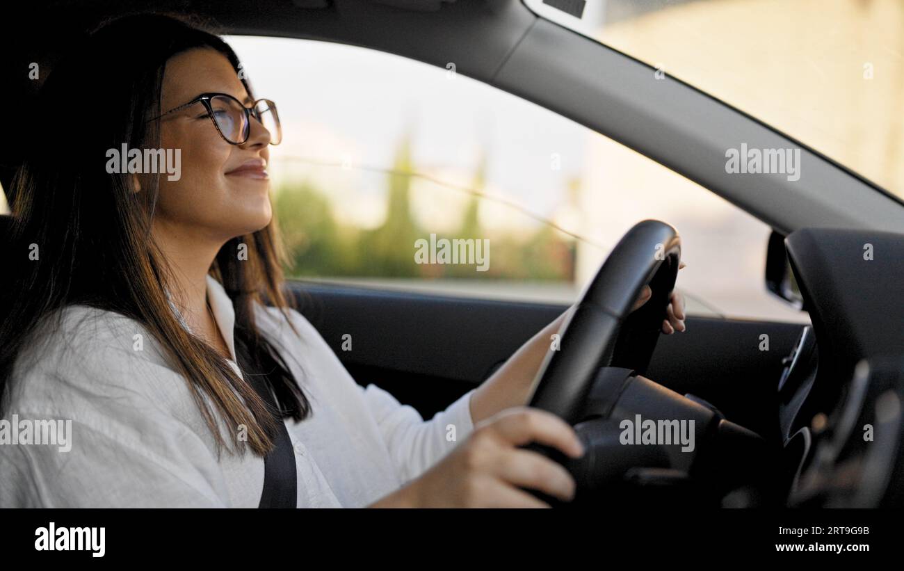 Young woman wearing glasses driving hi-res stock photography and images ...