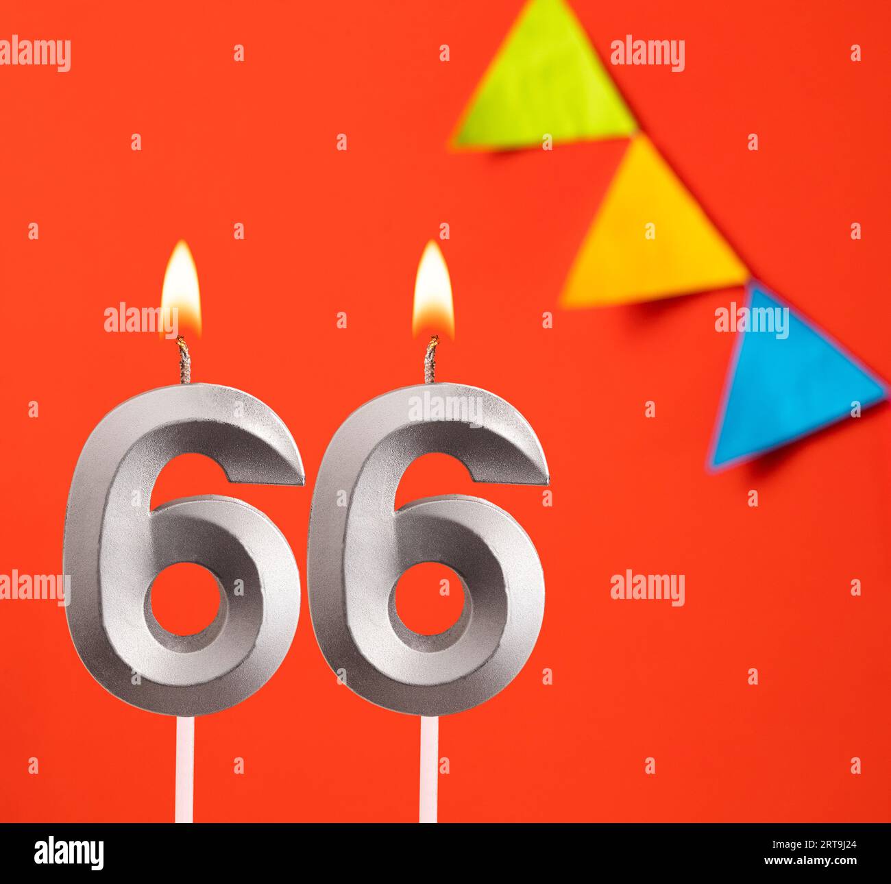 Birthday card - Number 66 candle in orange background Stock Photo - Alamy