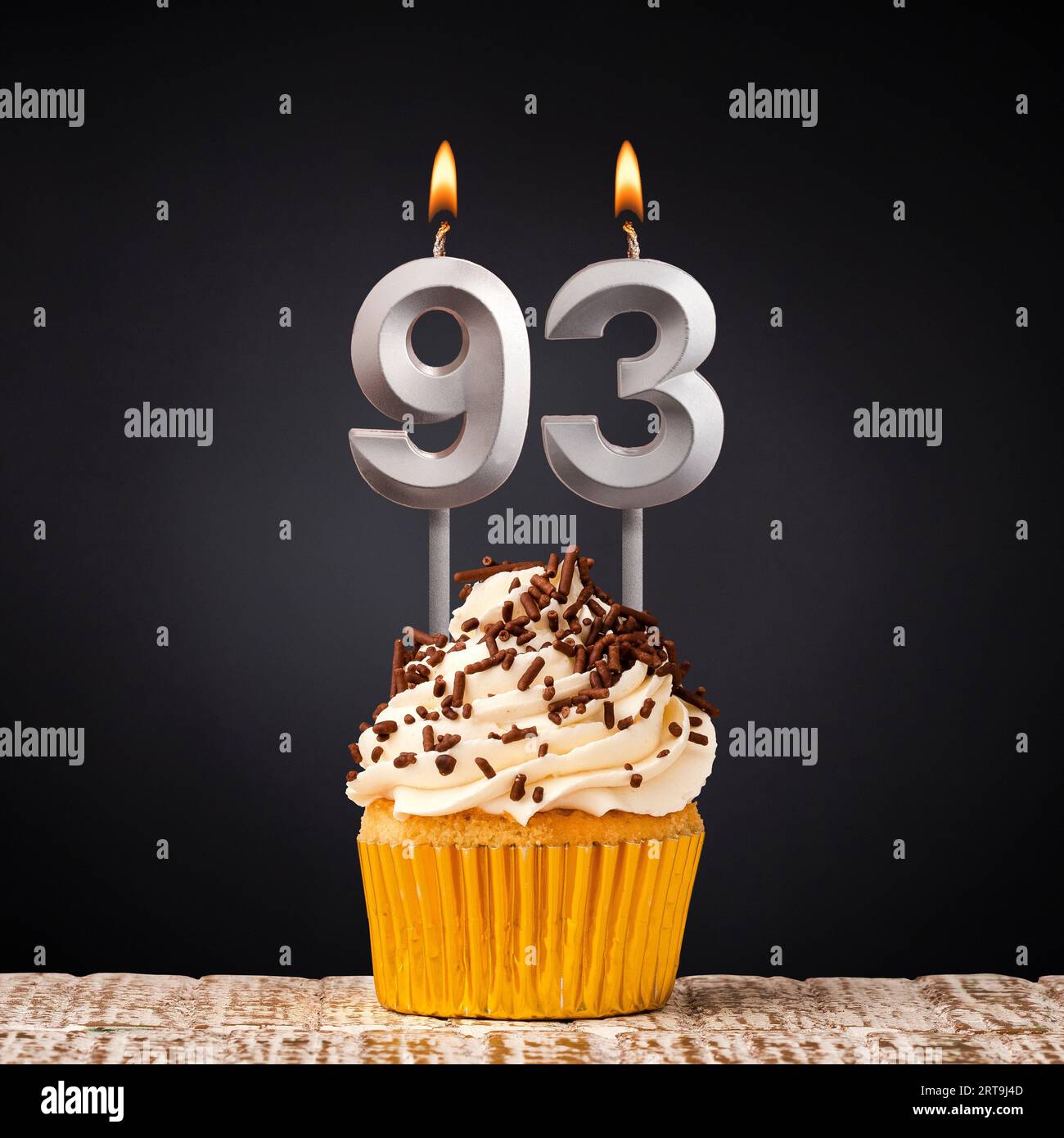 Birthday candle number 93 - Anniversary cupcake on black background ...