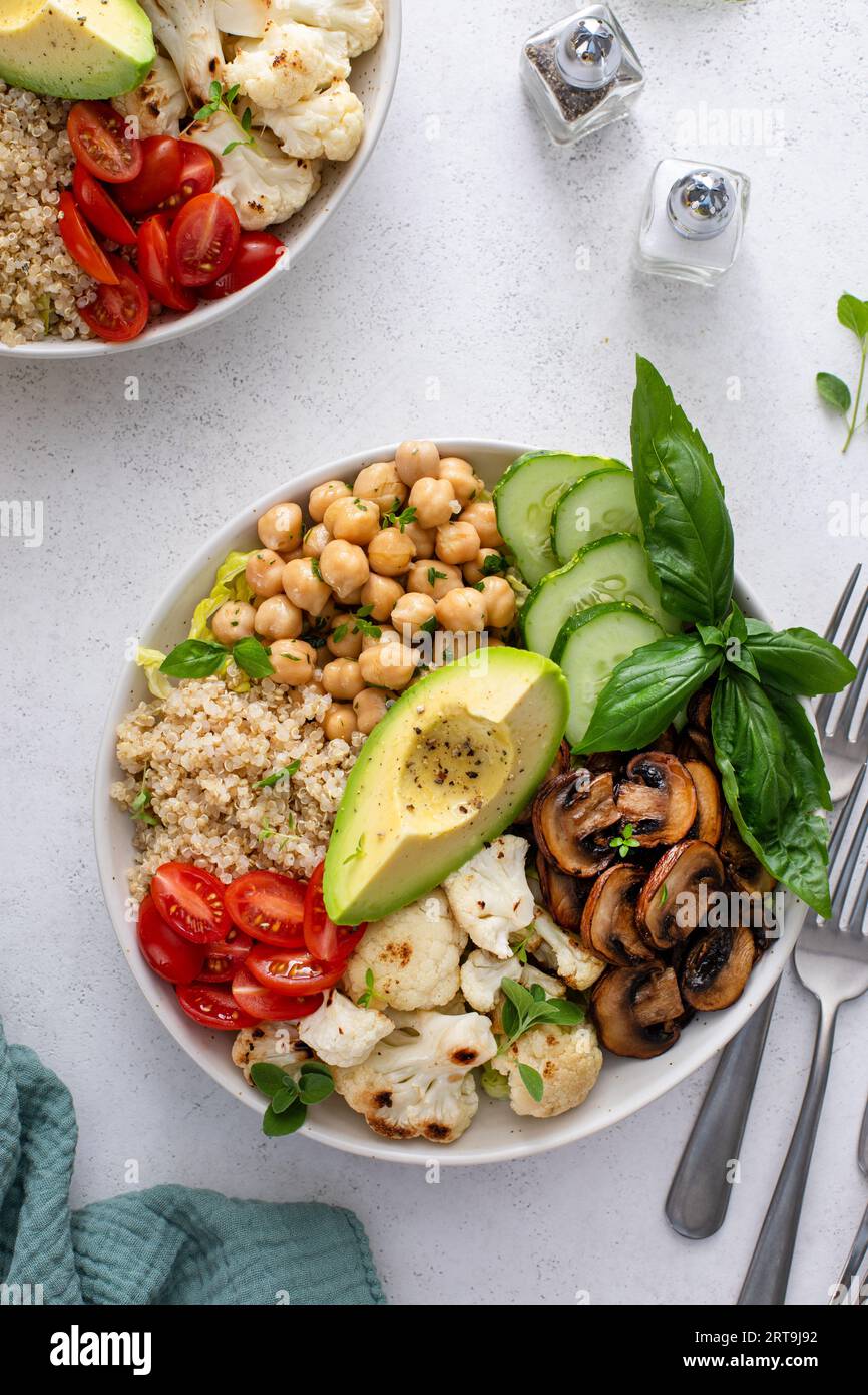 Healthy high protein vegan plant based lunch bowl with mushrooms, roasted cauliflower, herbed ...