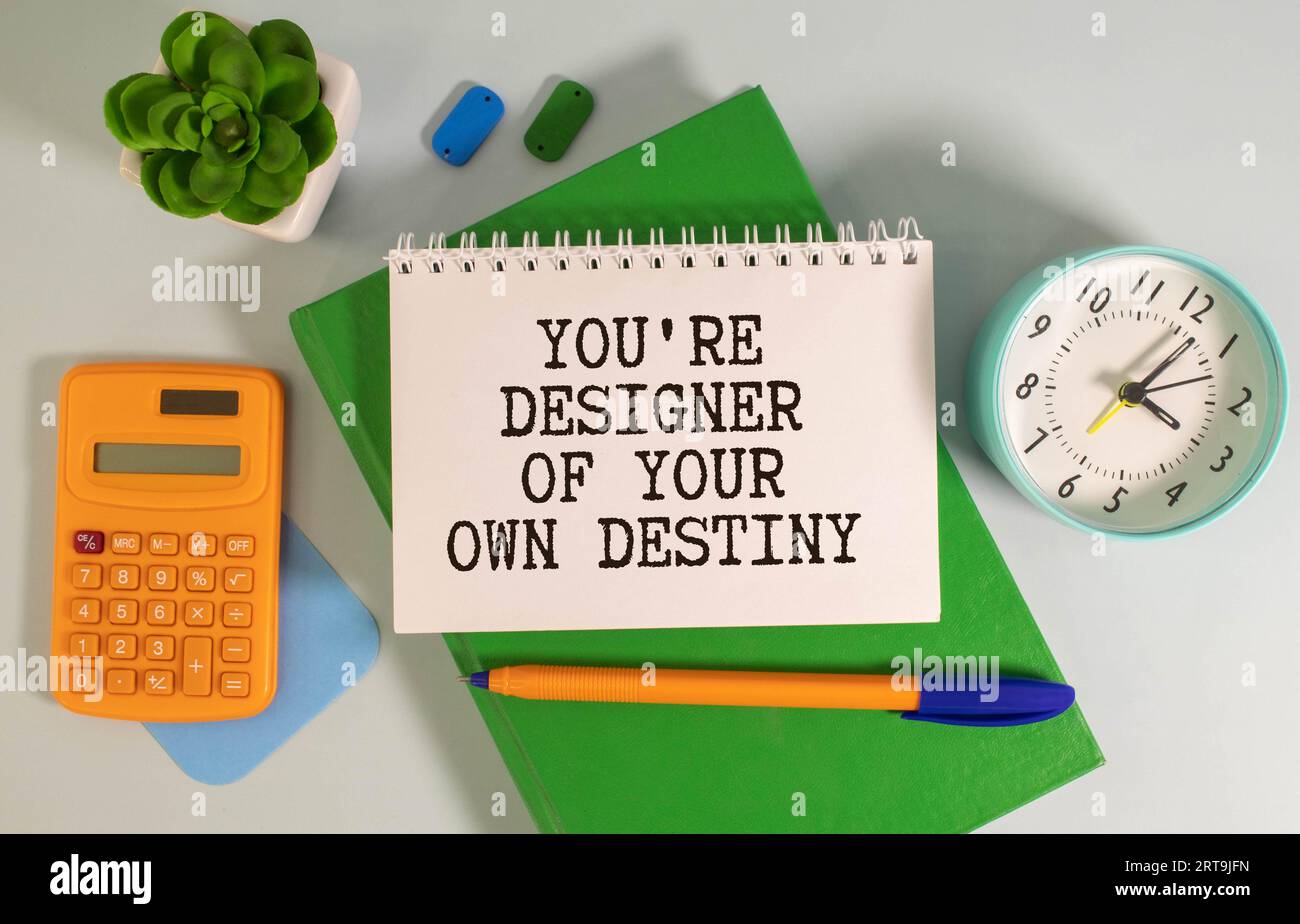 you're designer of your own destiny word on yellow notepaper with cork ...