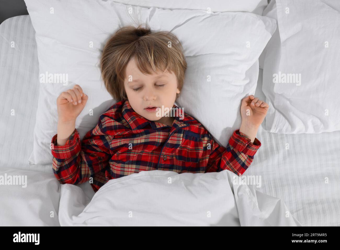 Little boy snoring while sleeping in bed, top view Stock Photo - Alamy