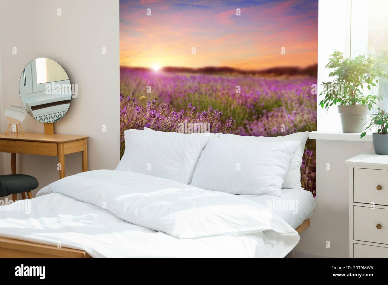 Cozy bedroom interior with comfortable furniture and beautiful floral ...