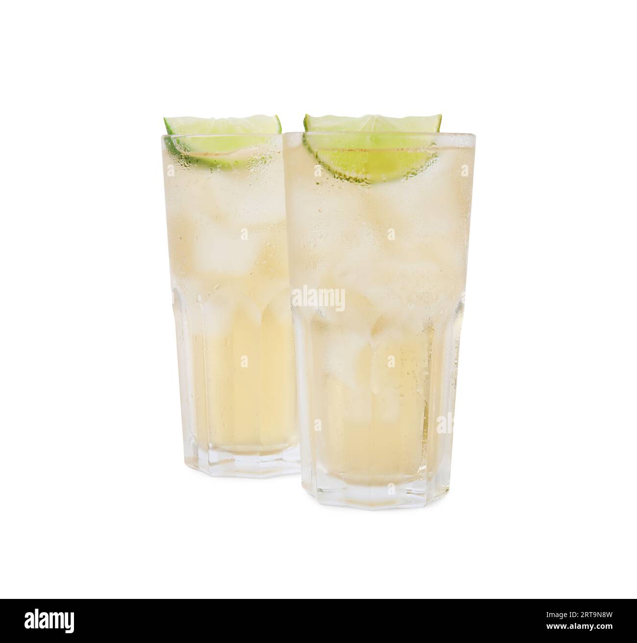 Glasses of tasty ginger ale with ice cubes and lime slices isolated on white Stock Photo - Alamy