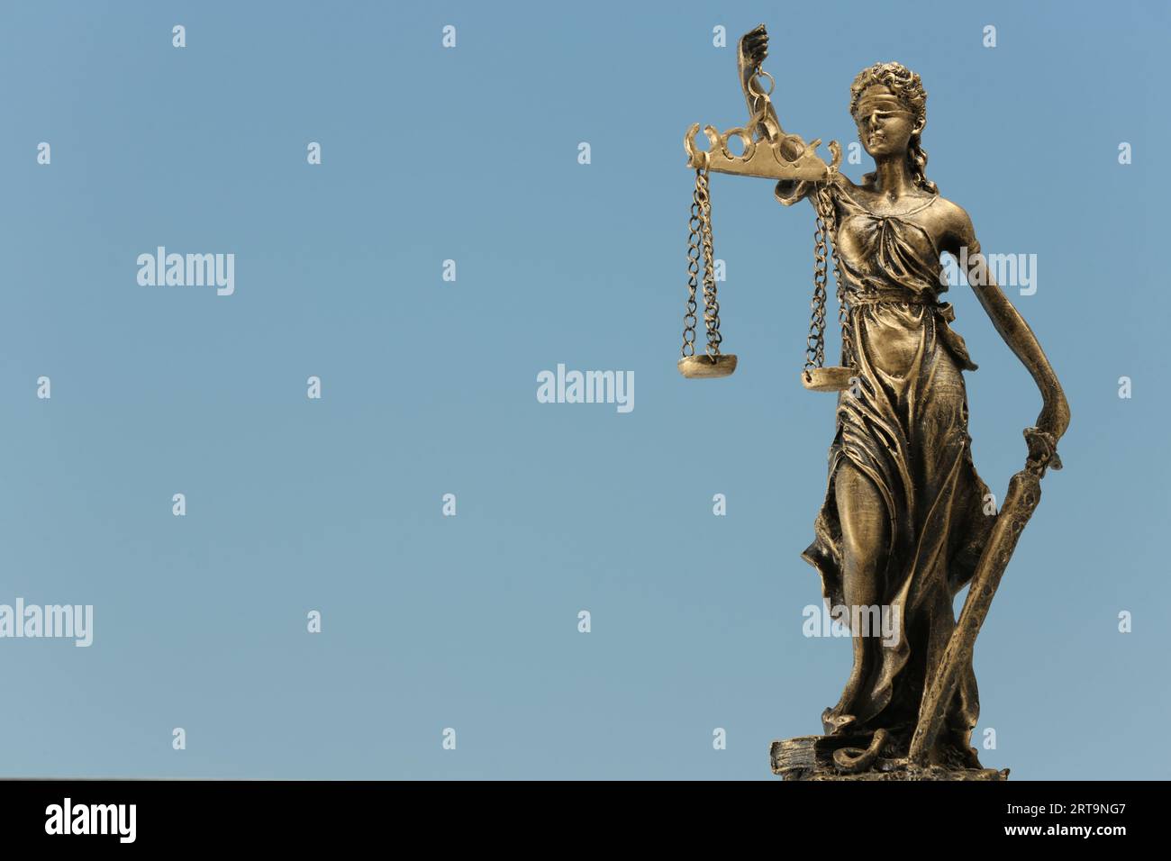 Figure of Lady Justice against sky, space for text. Symbol of fair ...