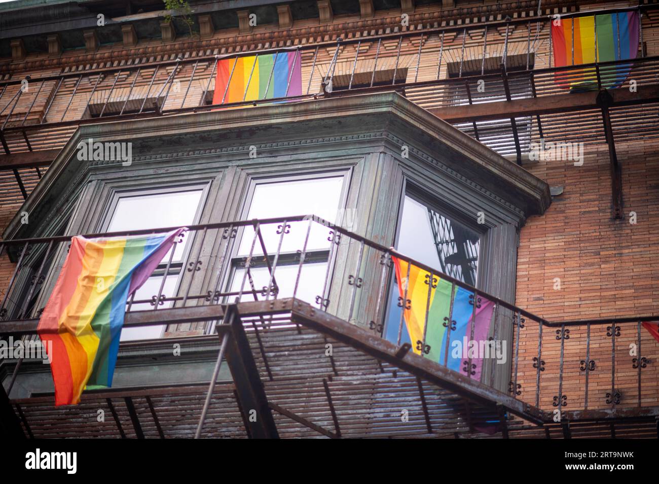 Traditional houses with lgbt flags hi-res stock photography and images ...