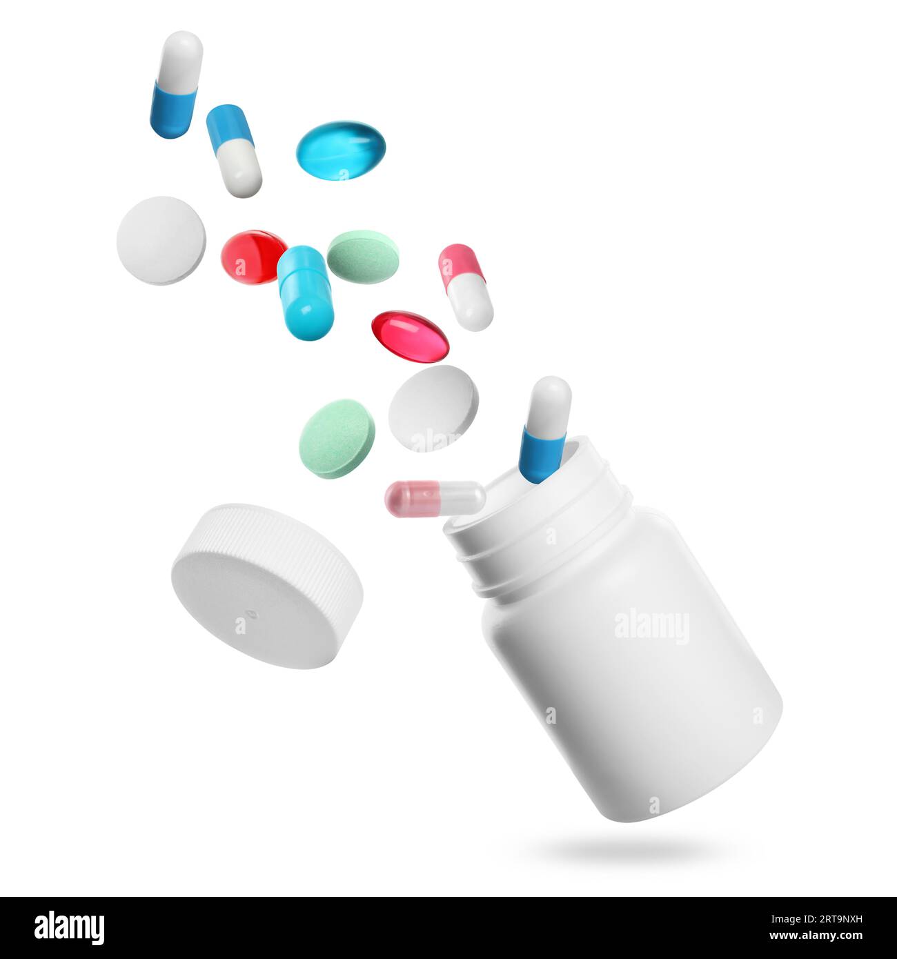 Many different colorful pills falling into bottle on white background ...