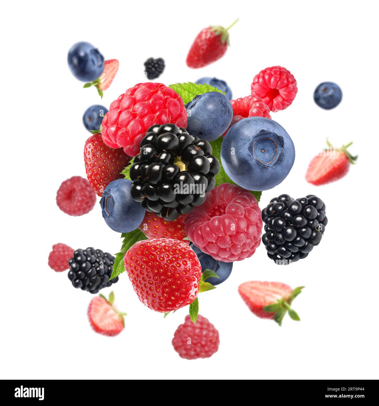 Many different berries flying on white background Stock Photo - Alamy