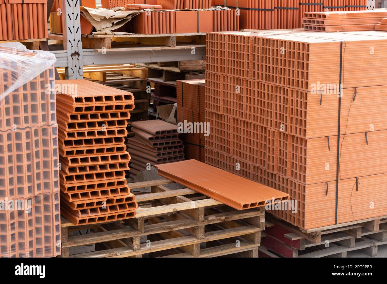 Pallets with bricks in a warehouse of brick factory Stock Photo - Alamy