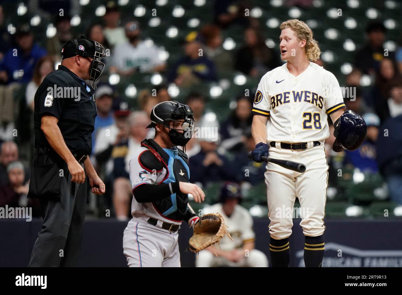 Milwaukee Brewers' Joey Wiemer (28) argues a call with umpire Mark ...