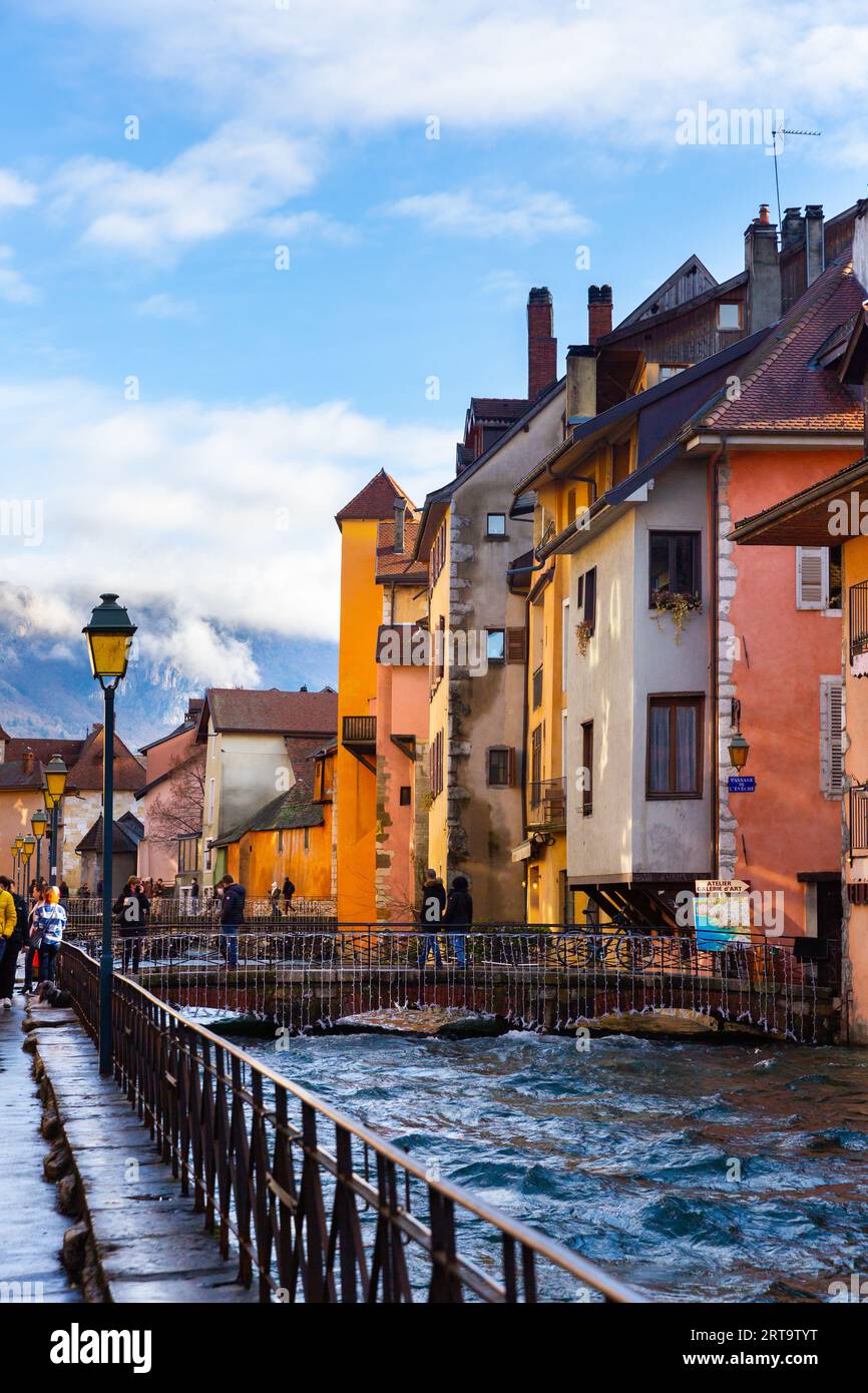 French town of Annecy with pastel houses along Thiou river on winter ...