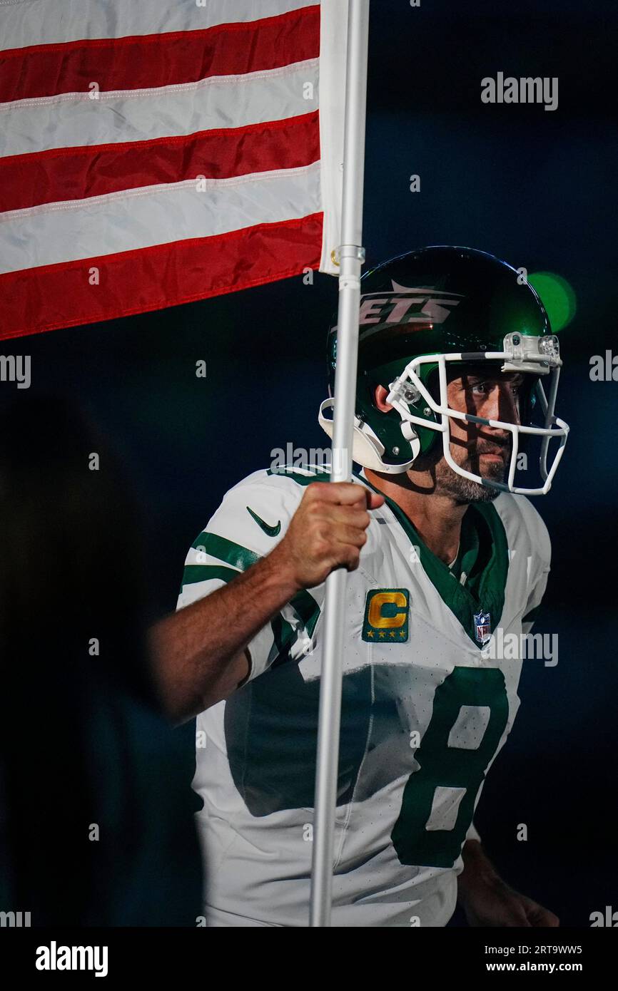 New York Jets quarterback Aaron Rodgers (8) enters the stadium before ...