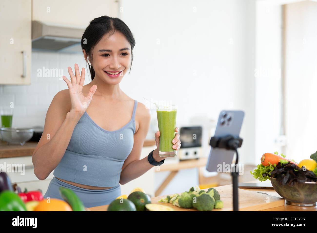 A beautiful and cheerful Asian female influencer or online nutrition ...