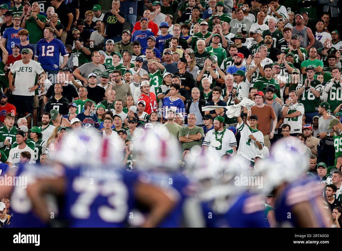 Football fans watch play between the New York Jets and the Buffalo ...