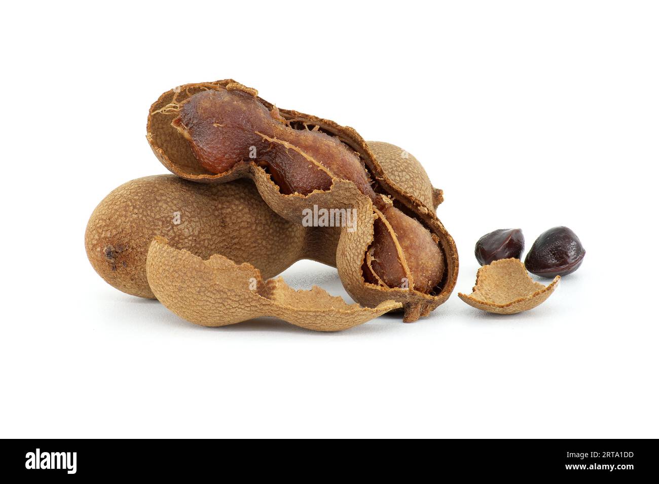 Tamarind fruits, whole and cracked open isolated on white background ...