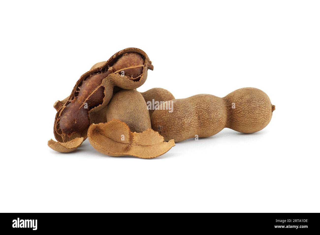 Tamarind fruits, whole and cracked open isolated on white background ...