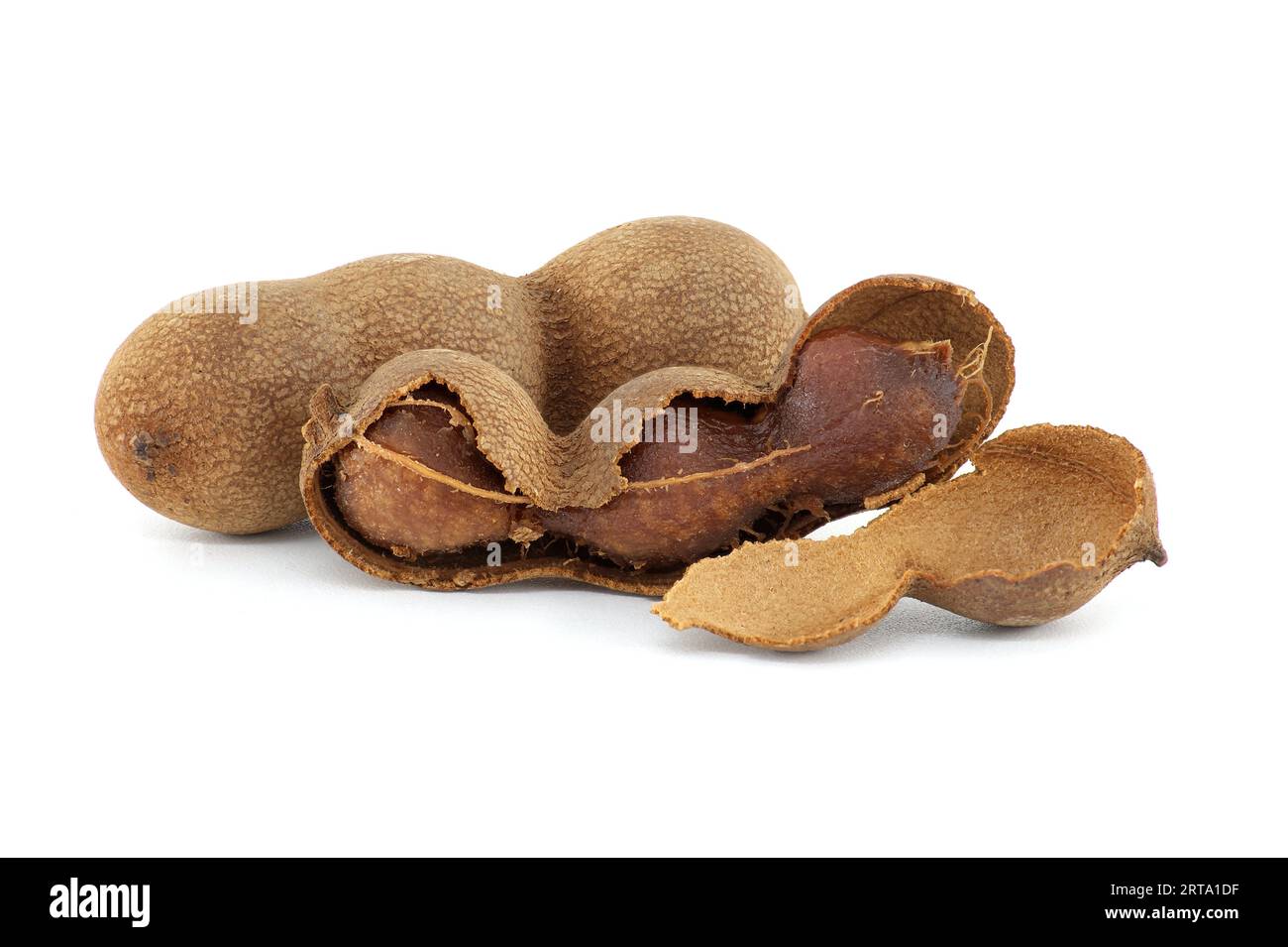Tamarind fruits, whole and cracked open isolated on white background ...