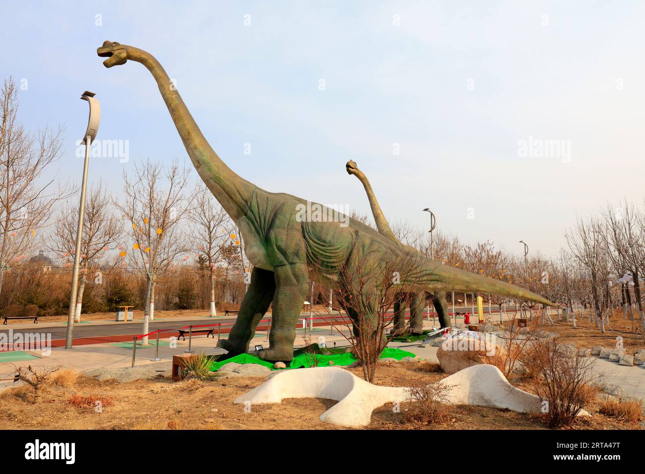 dinosaur model in the park Stock Photo - Alamy