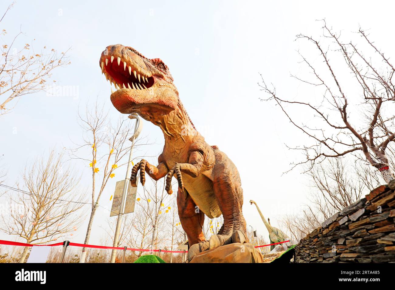 dinosaur model in the park Stock Photo - Alamy