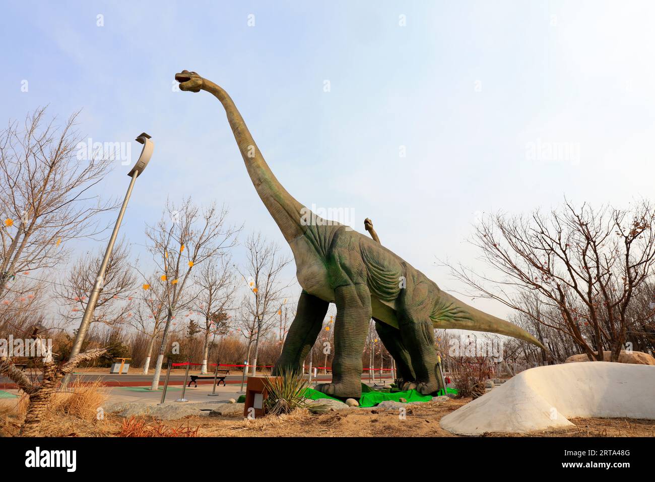 dinosaur model in the park Stock Photo - Alamy