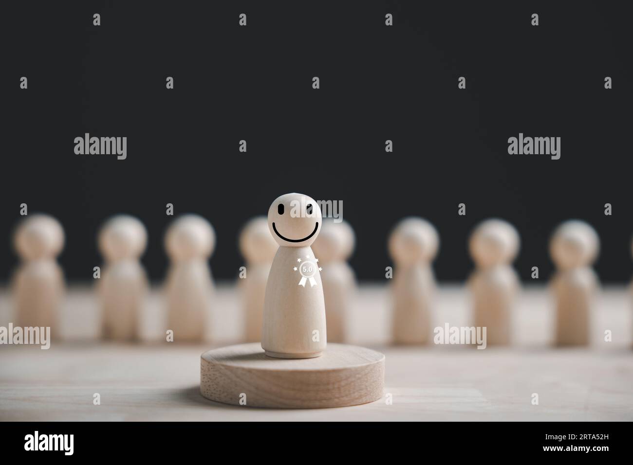 Hand choosing a wooden figure as the chosen leader from the crowd Stock ...