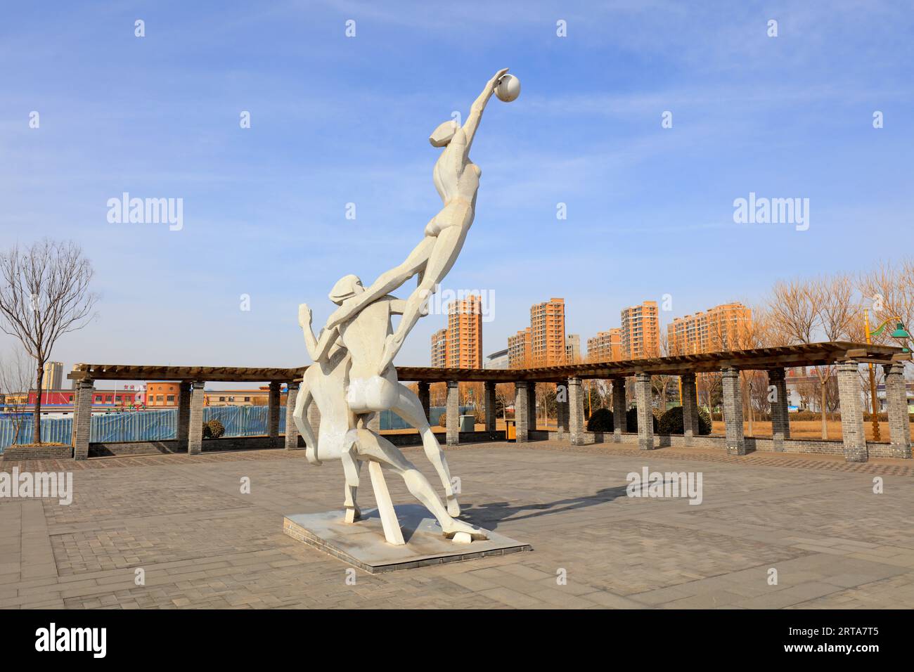 Volleyball players sculpture in the square, China Stock Photo - Alamy
