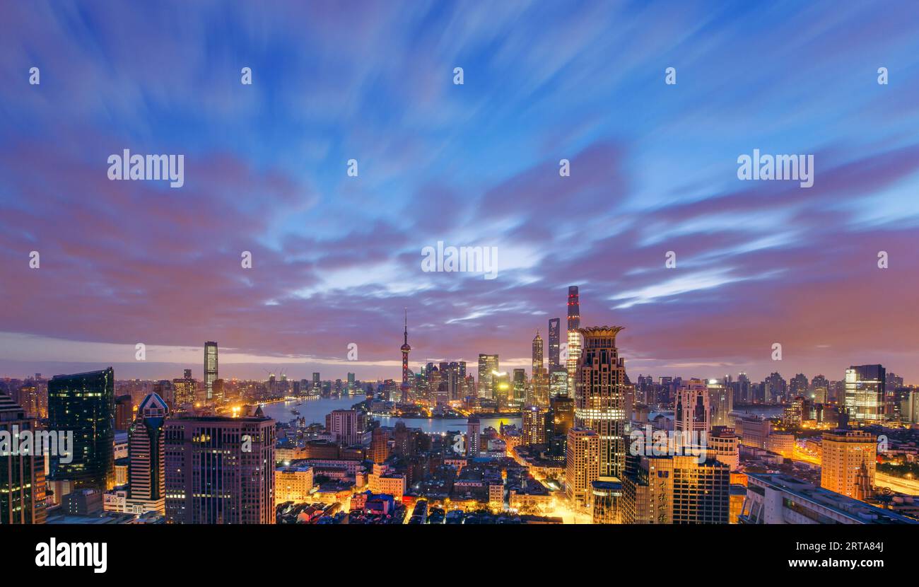 An illuminated nighttime city skyline featuring a long exposure ...
