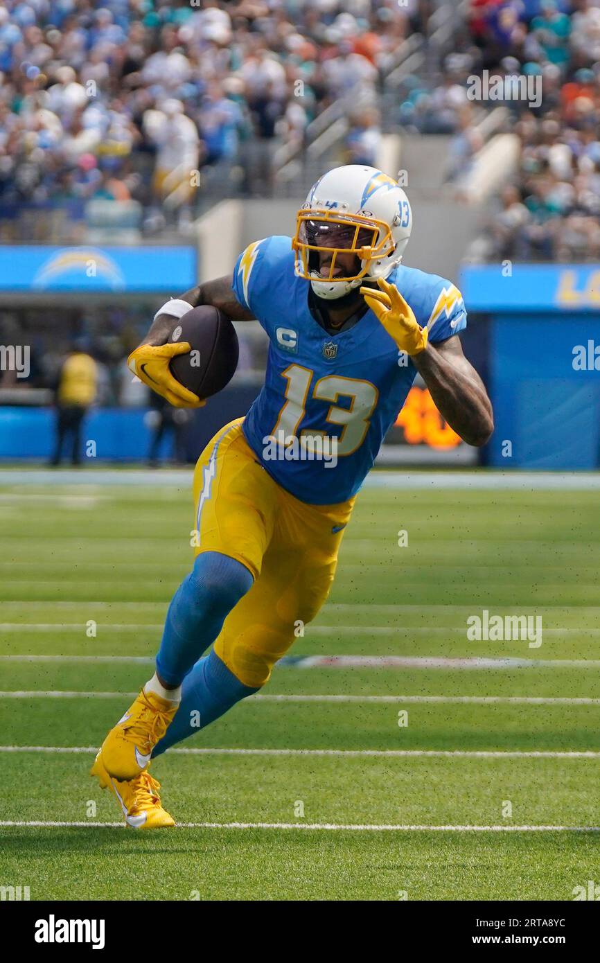 Los Angeles Chargers wide receiver Keenan Allen runs a pass during an ...