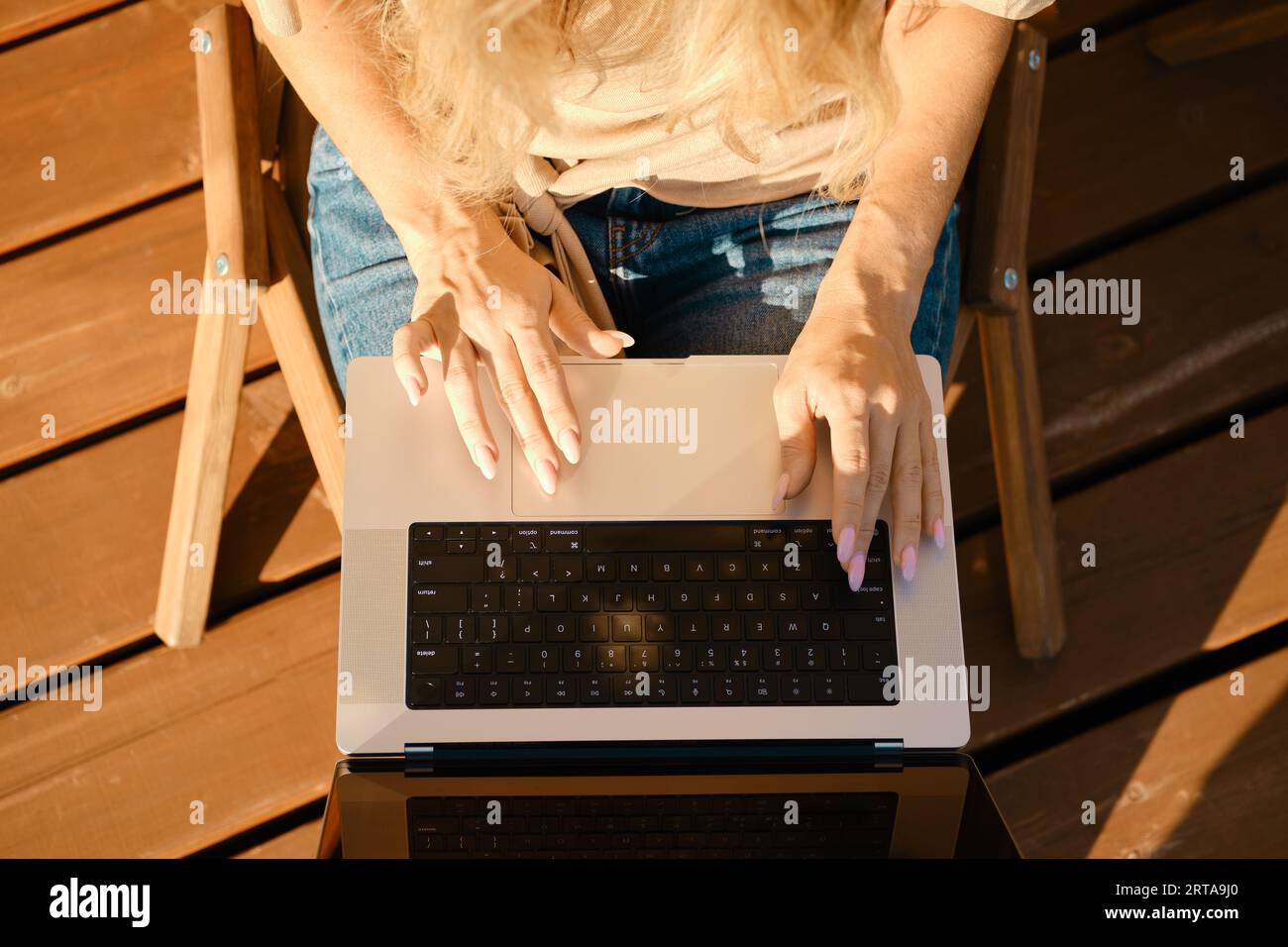 Top view of female hands over keyboard of laptop Stock Photo - Alamy