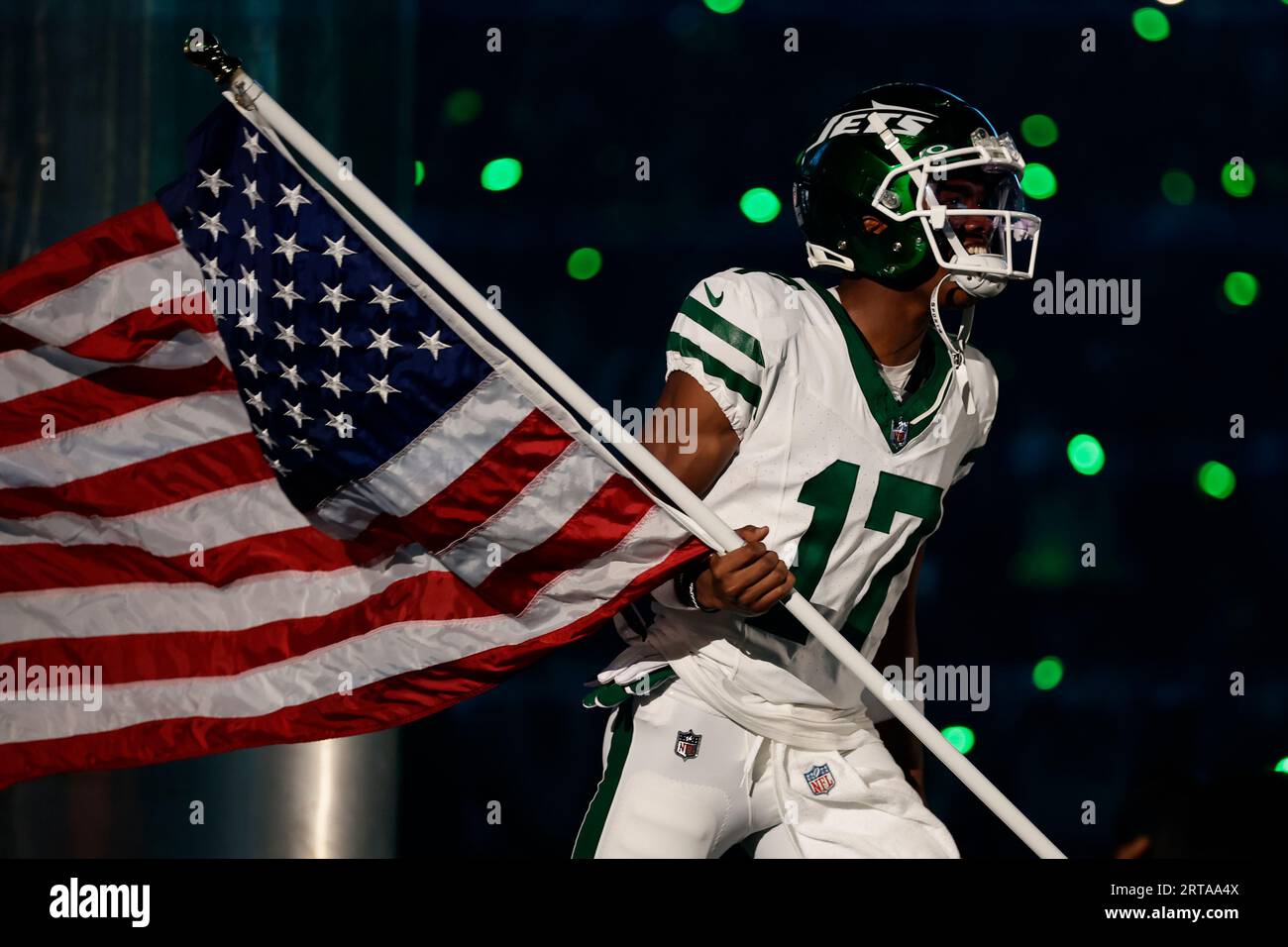 New York Jets wide receiver Garrett Wilson (17) carries an American ...