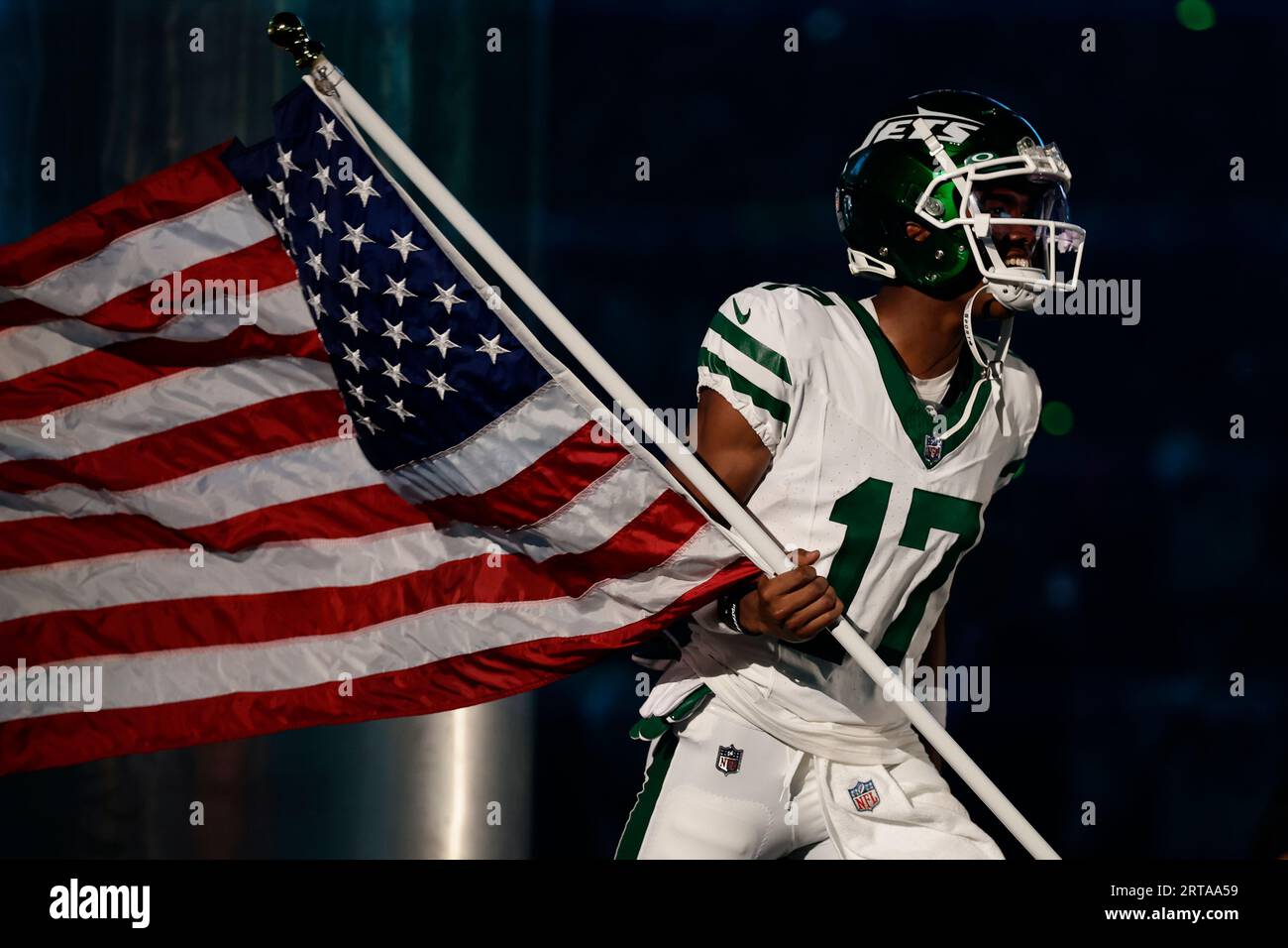New York Jets wide receiver Garrett Wilson (17) carries an American ...
