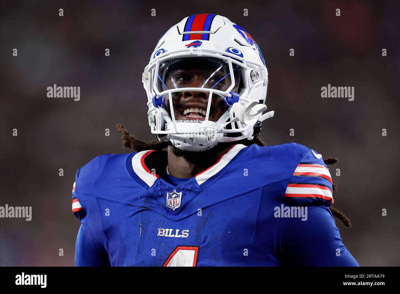 Buffalo Bills running back James Cook (4) reacts after carrying the ...