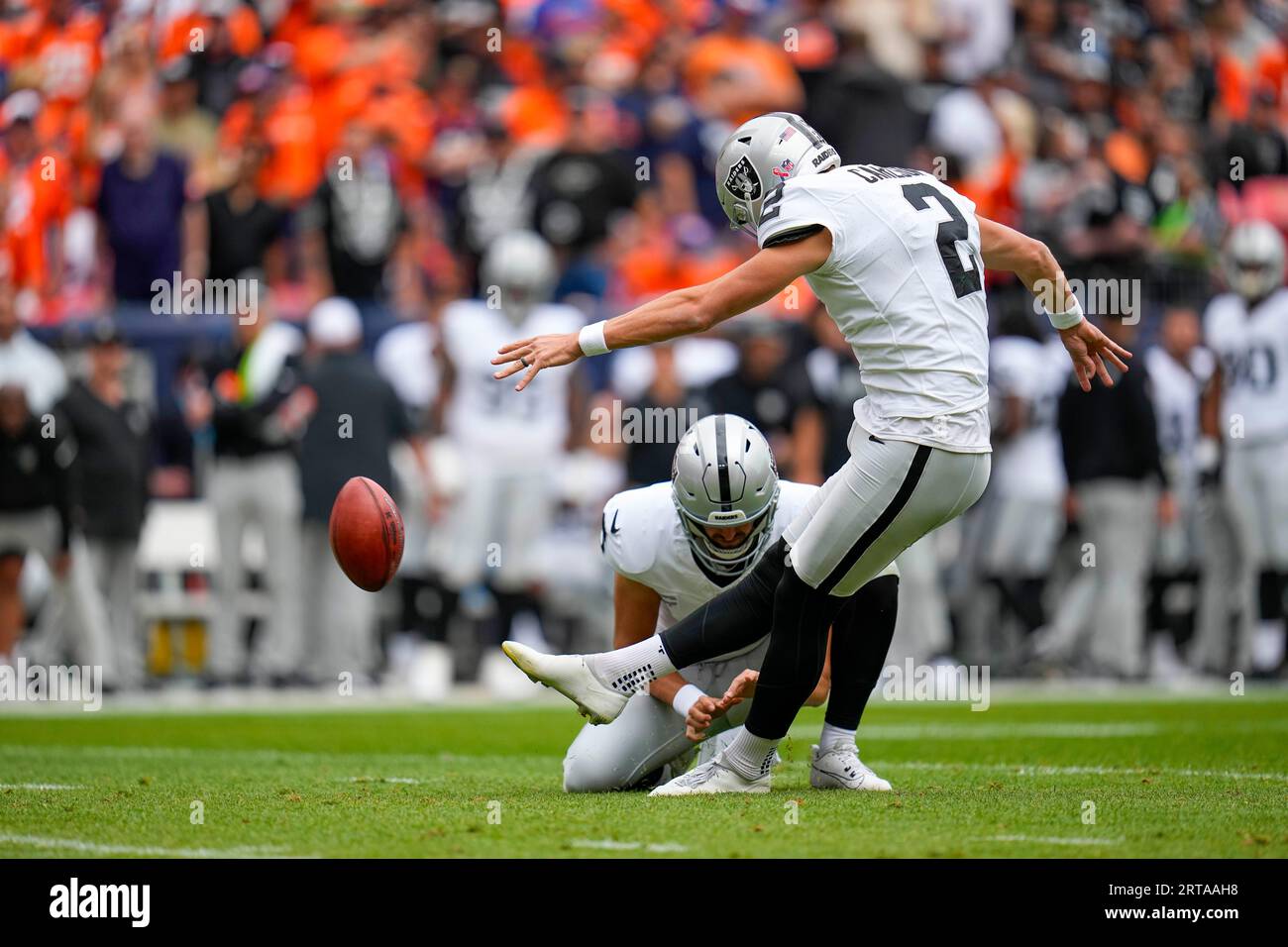 Las Vegas Raiders place kicker Daniel Carlson (2) kicks an extra point ...