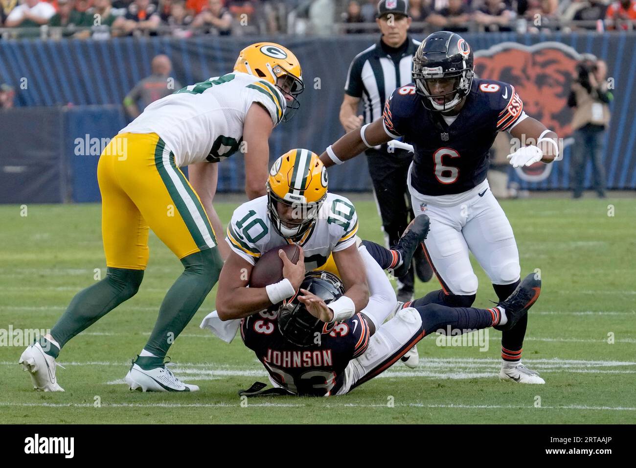 Green Bay Packers quarterback Jordan Love caries the ball as Chicago ...