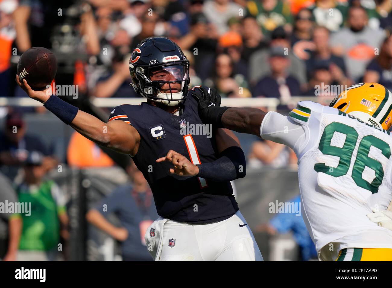Chicago Bears quarterback Justin Fields passes under pressure from ...