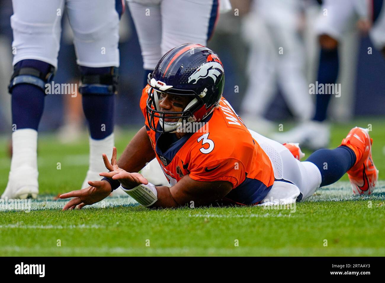Denver Broncos quarterback Russell Wilson (3) calls fora penalty ...