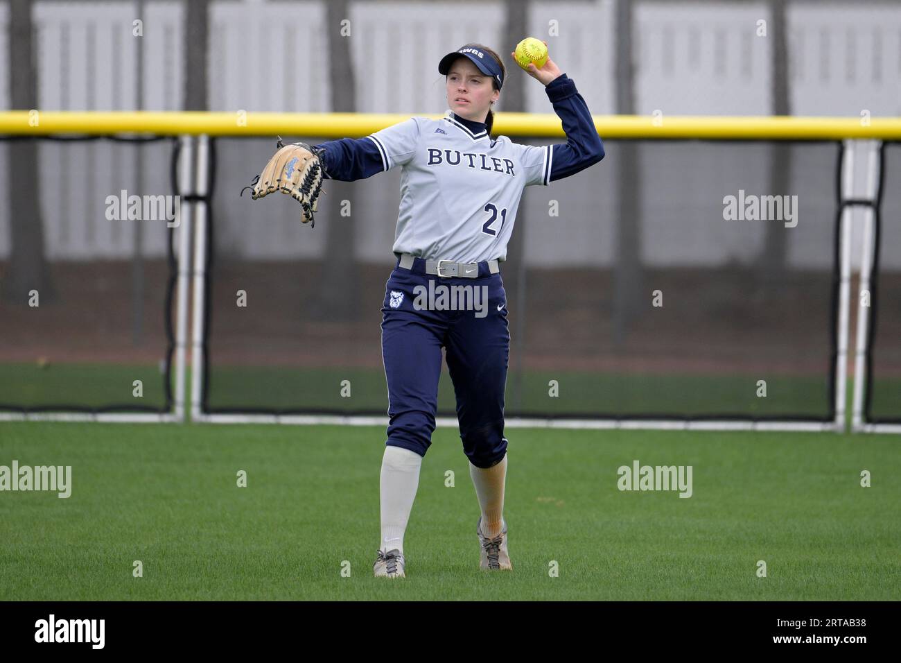 Butler outfielder Kaylee Gross (21) throws after catching a fly ball ...
